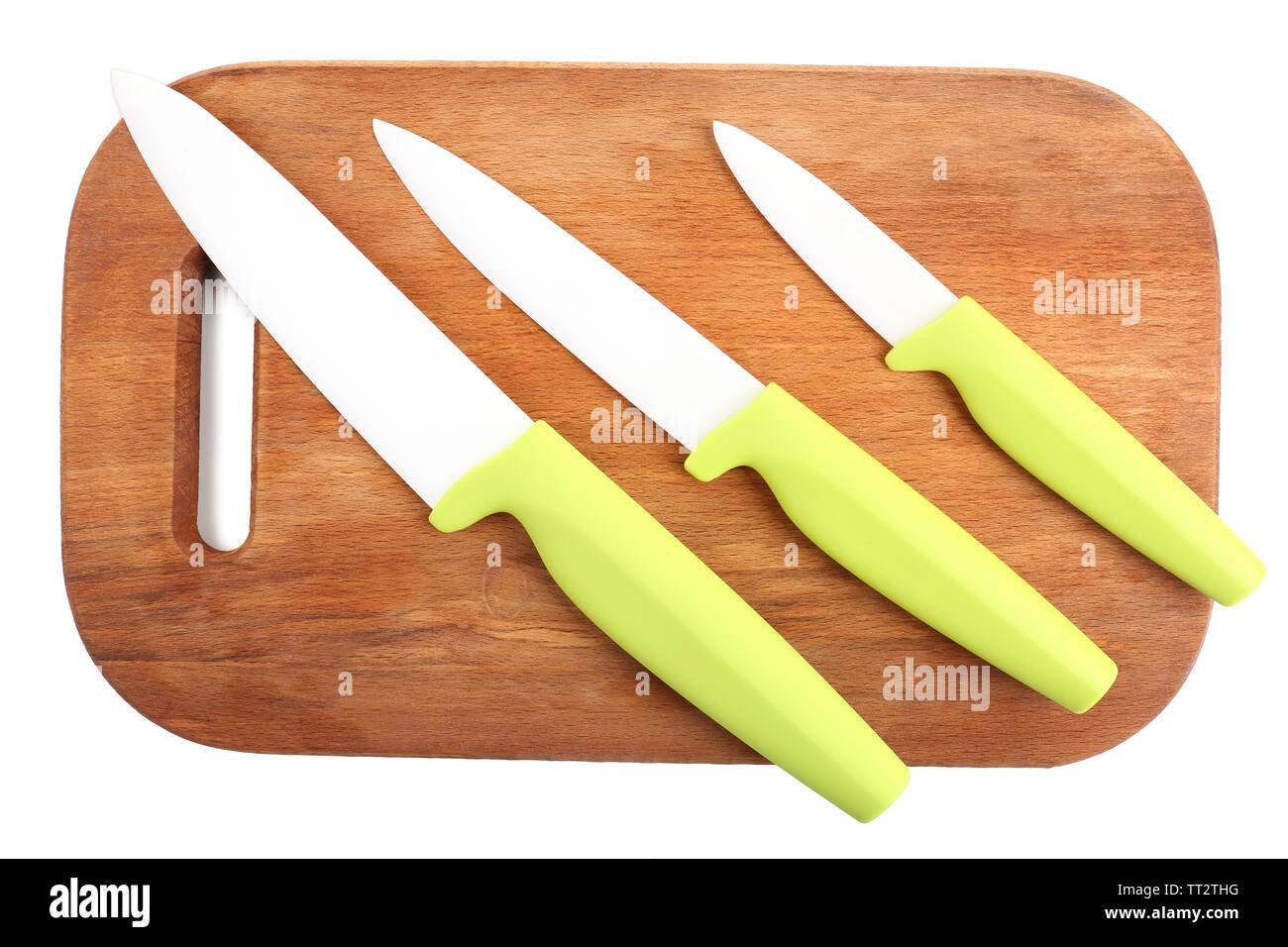 Kitchen knives and cutting board isolated on white Stock Photo - Alamy