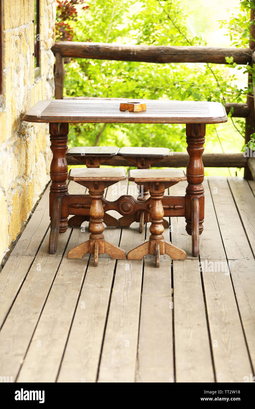 Wooden old bench and table Stock Photo - Alamy