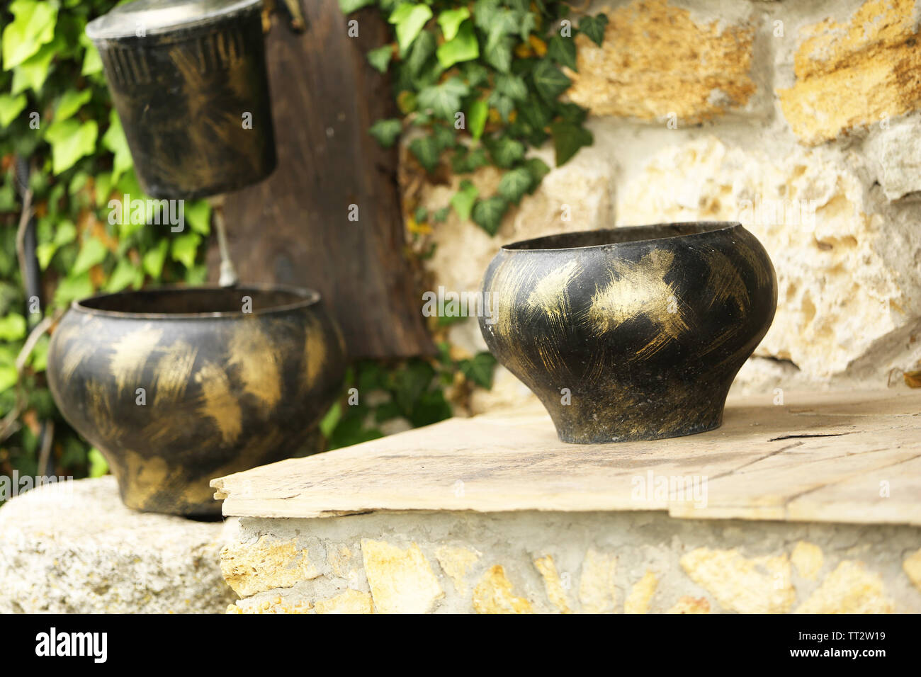 Old retro cauldrons, outdoors Stock Photo - Alamy