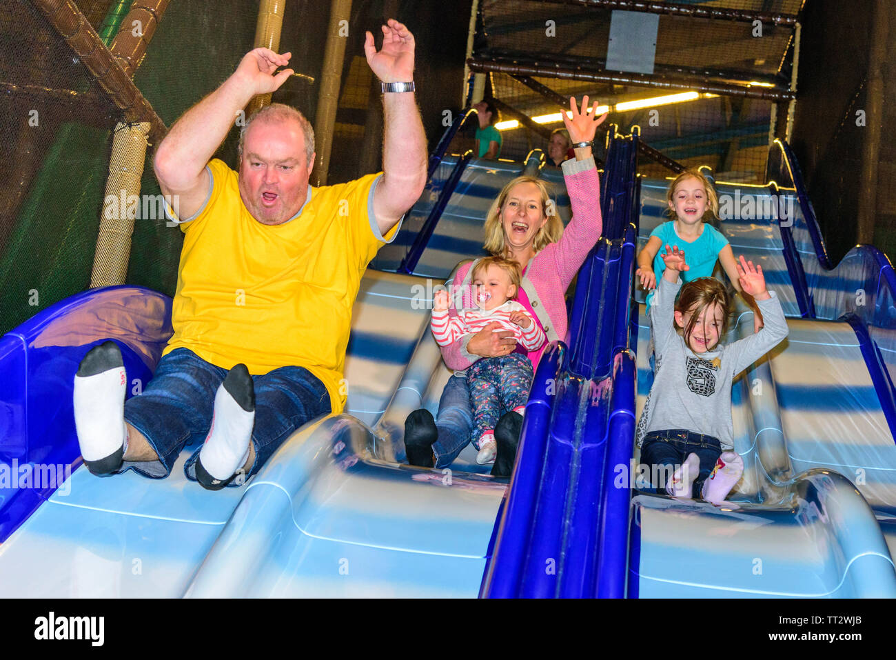 Group of kids sliding hi-res stock photography and images - Alamy