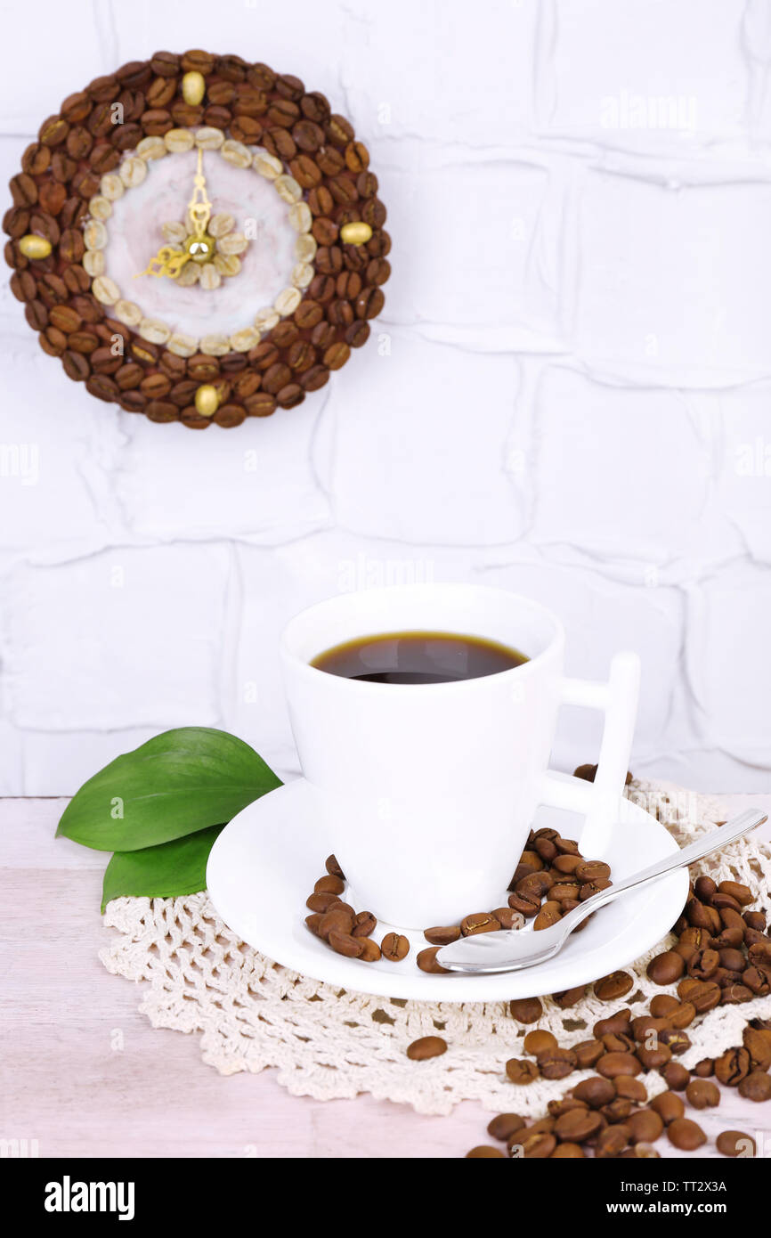 Still life cup of coffee and clock, on grey wall background Stock Photo ...