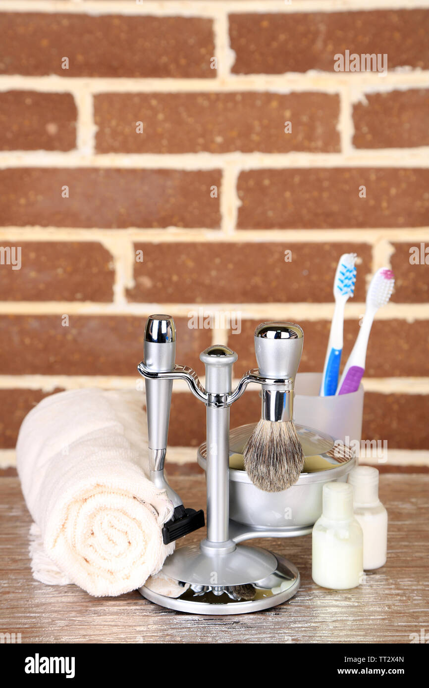 Male luxury shaving kit on shelf, on bricks wall background Stock Photo ...