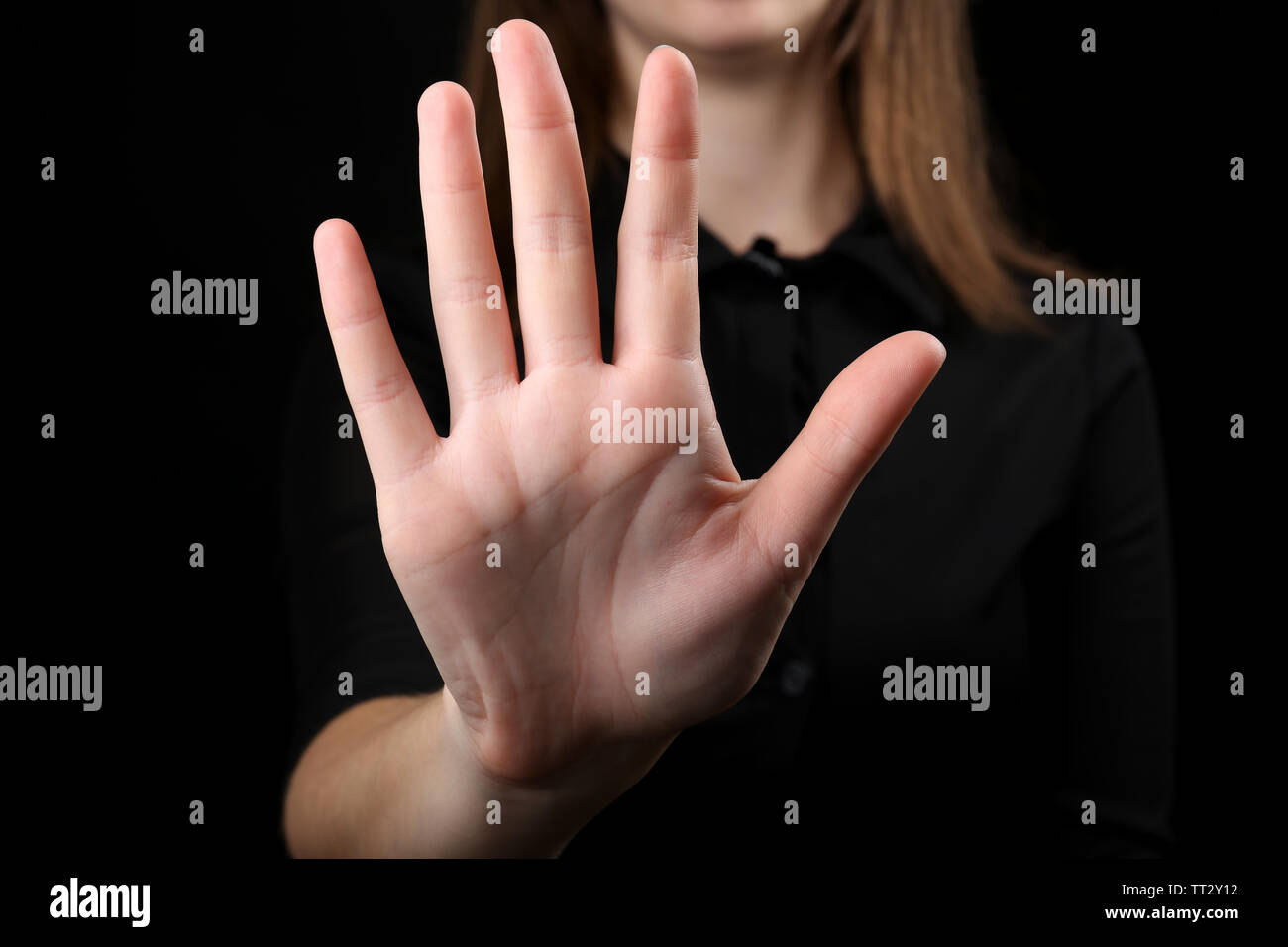 Human hand on black background Stock Photo - Alamy