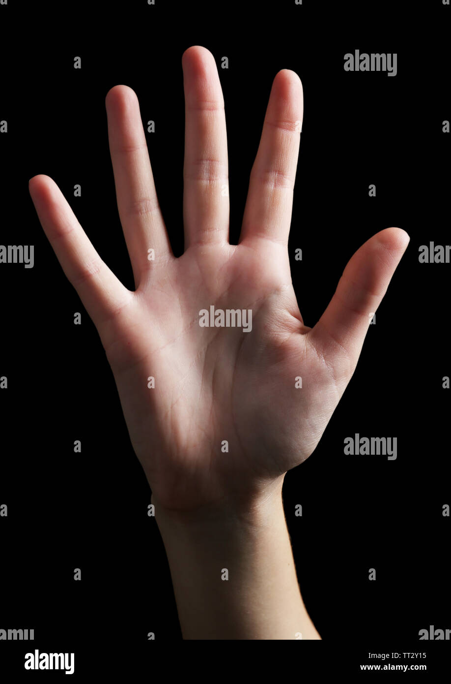 Human hand on black background Stock Photo - Alamy