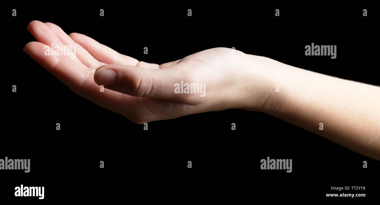 Human hand on black background Stock Photo - Alamy