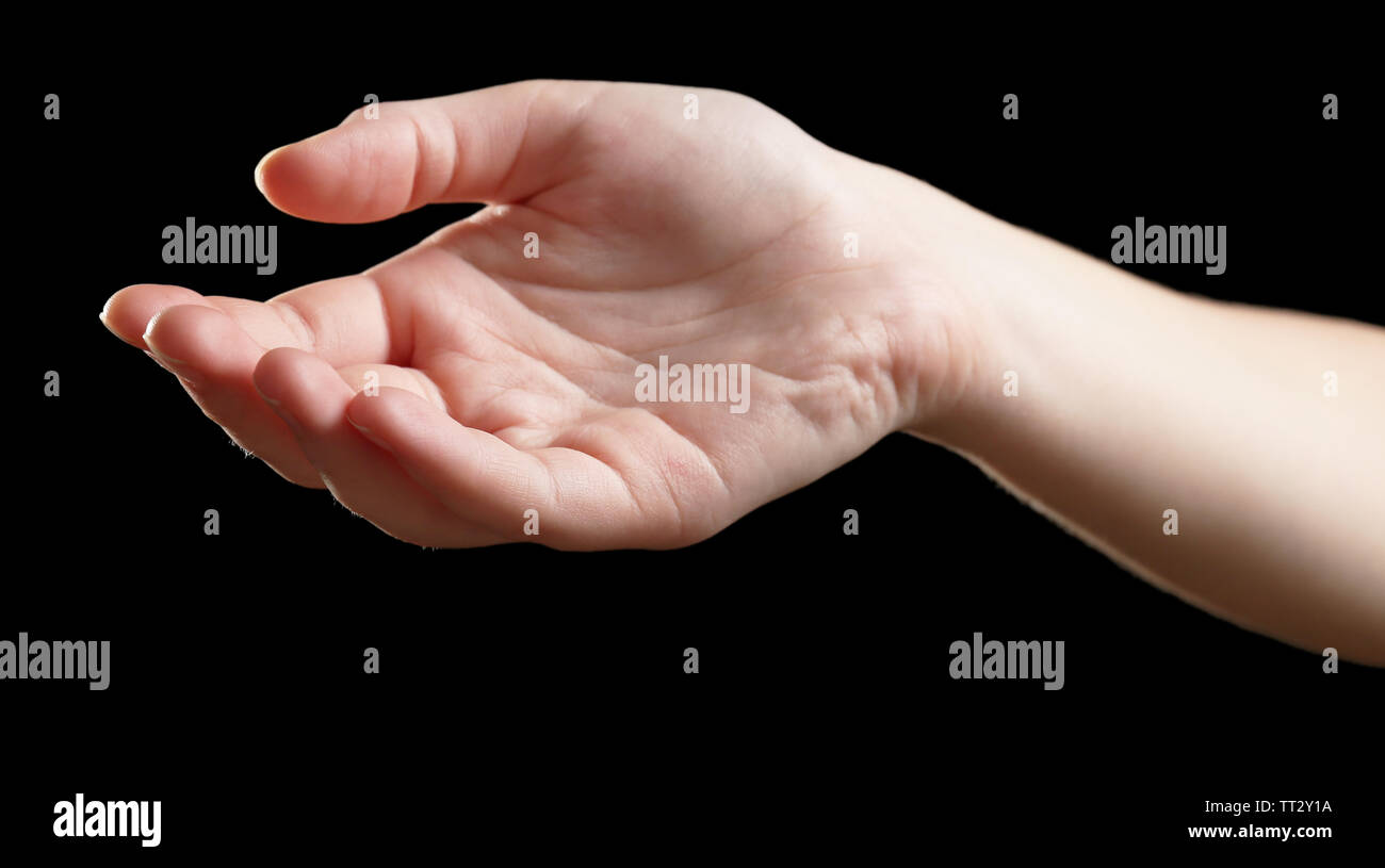 Human hand on black background Stock Photo - Alamy