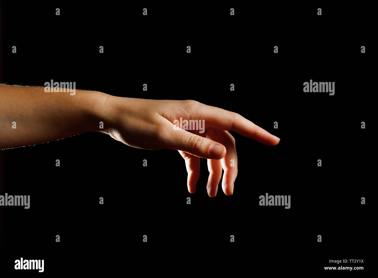 Human hand on black background Stock Photo - Alamy