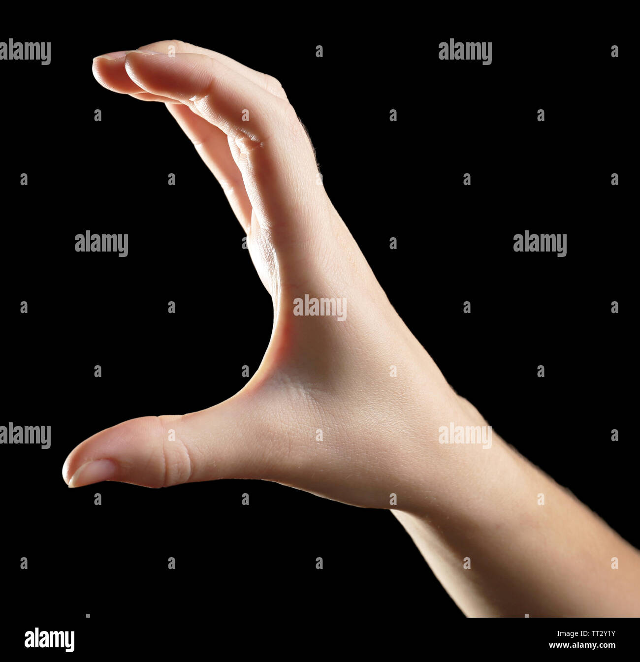 Human hand on black background Stock Photo - Alamy