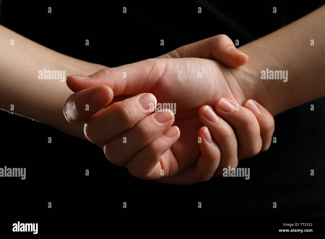 Human hands on black background Stock Photo - Alamy
