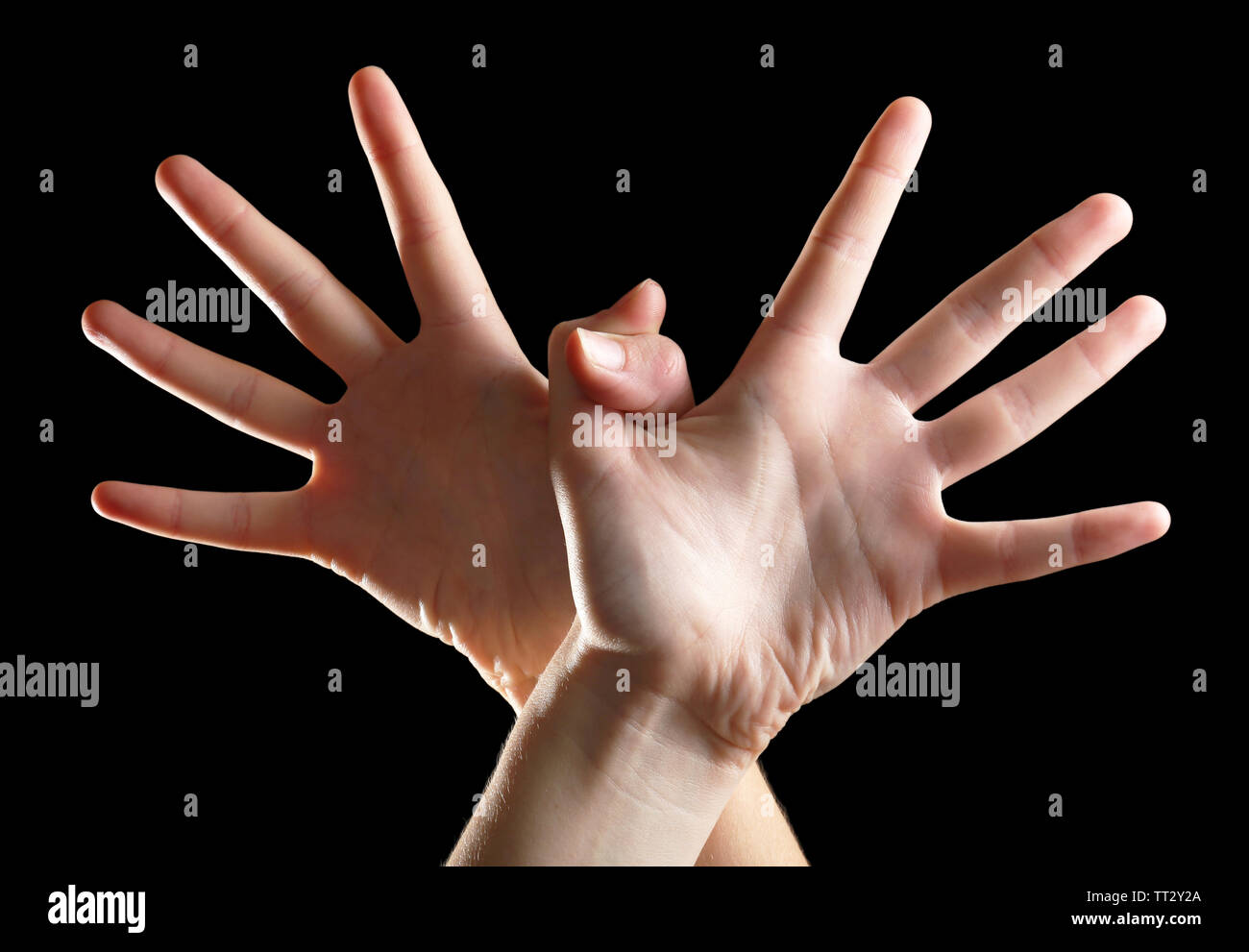 Human hands on black background Stock Photo - Alamy
