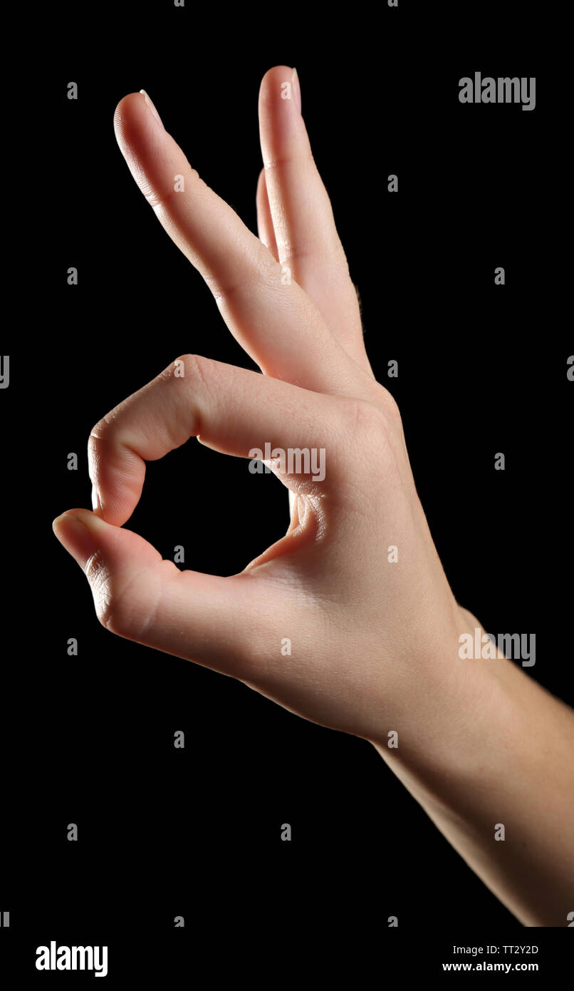 Human hand on black background Stock Photo - Alamy