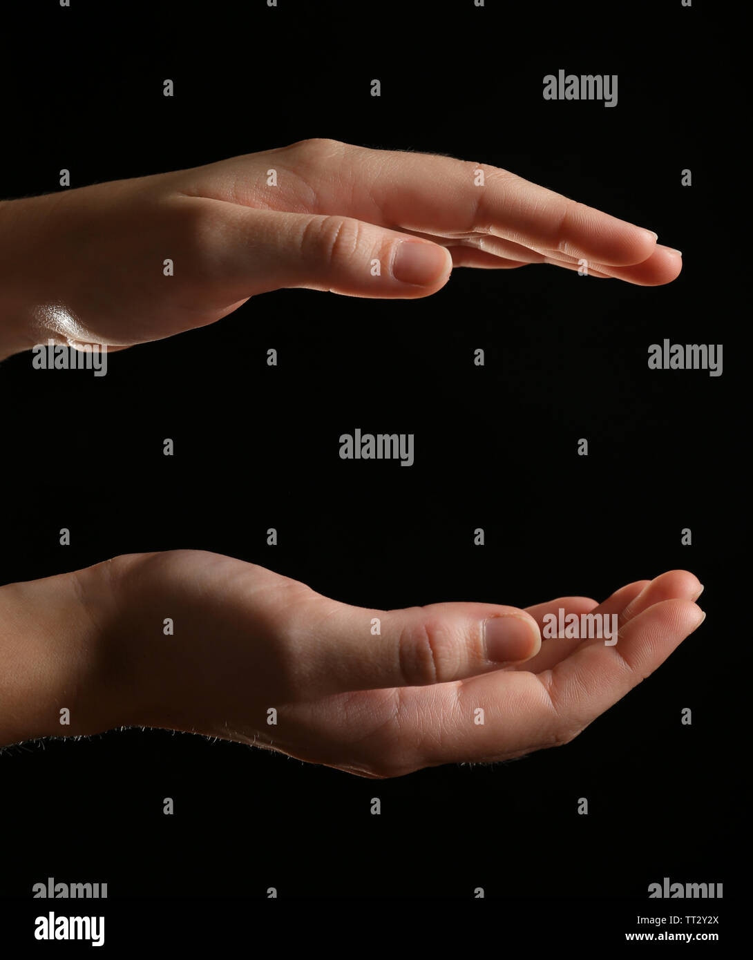 Human hands on black background Stock Photo - Alamy