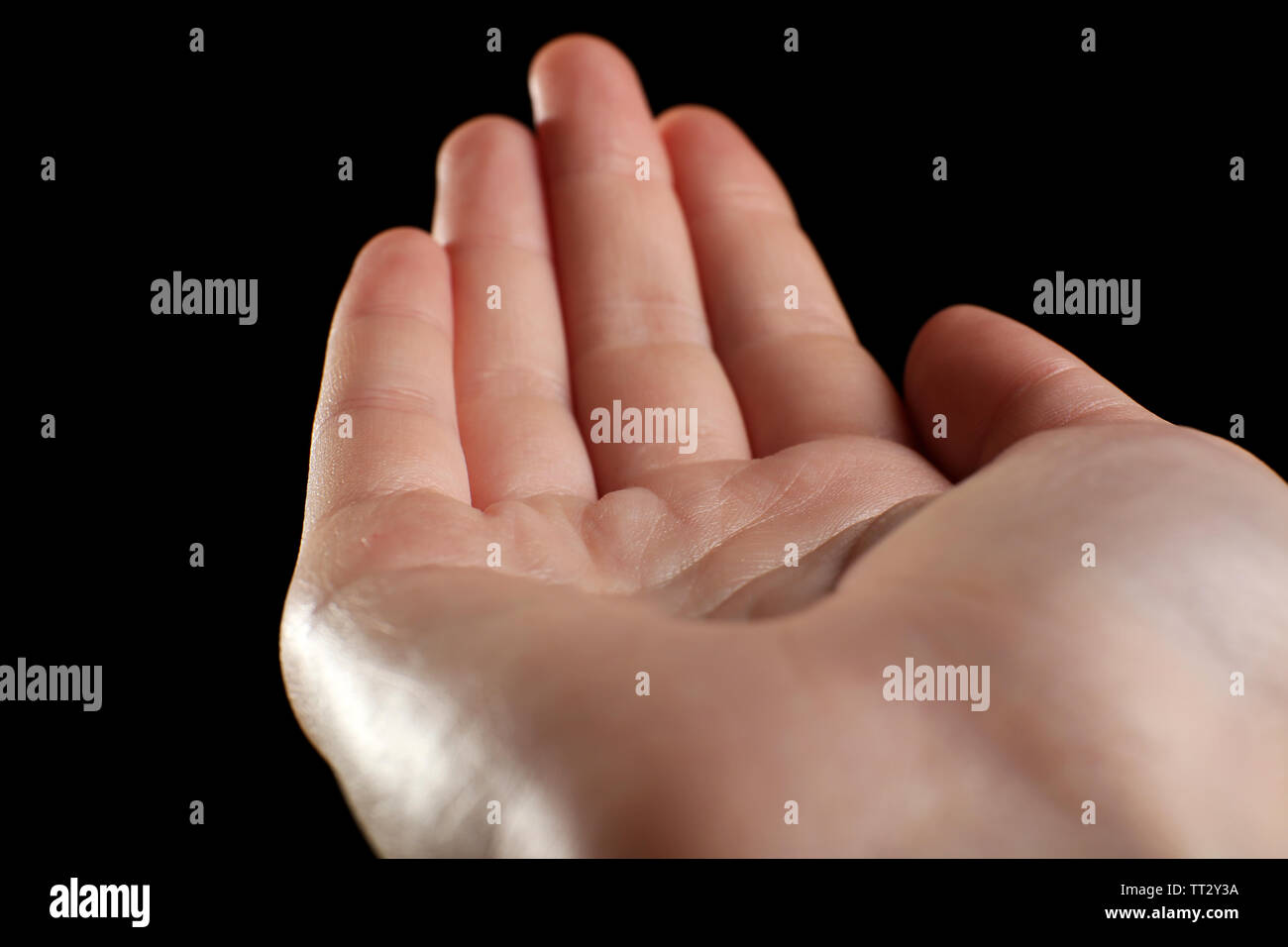 Human hand on black background Stock Photo - Alamy
