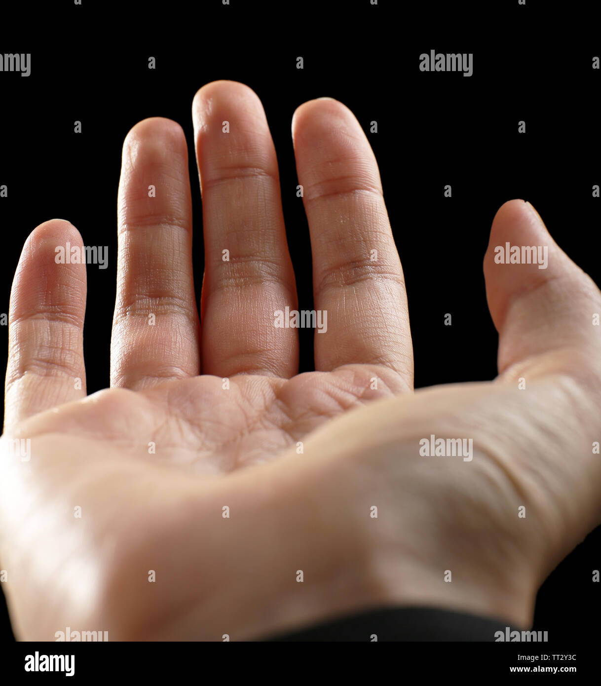 Human hand on black background Stock Photo - Alamy