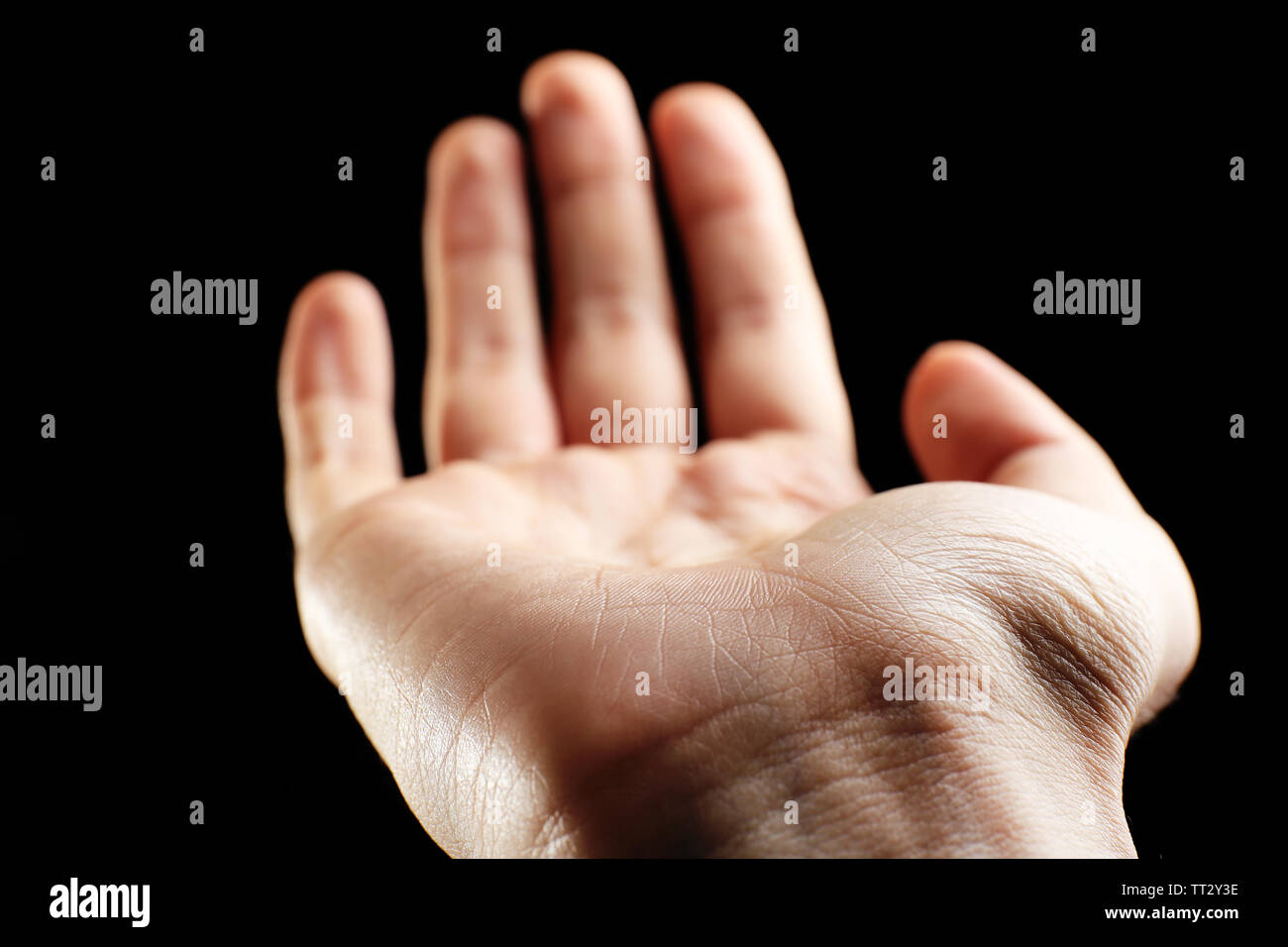 Human hand on black background Stock Photo - Alamy