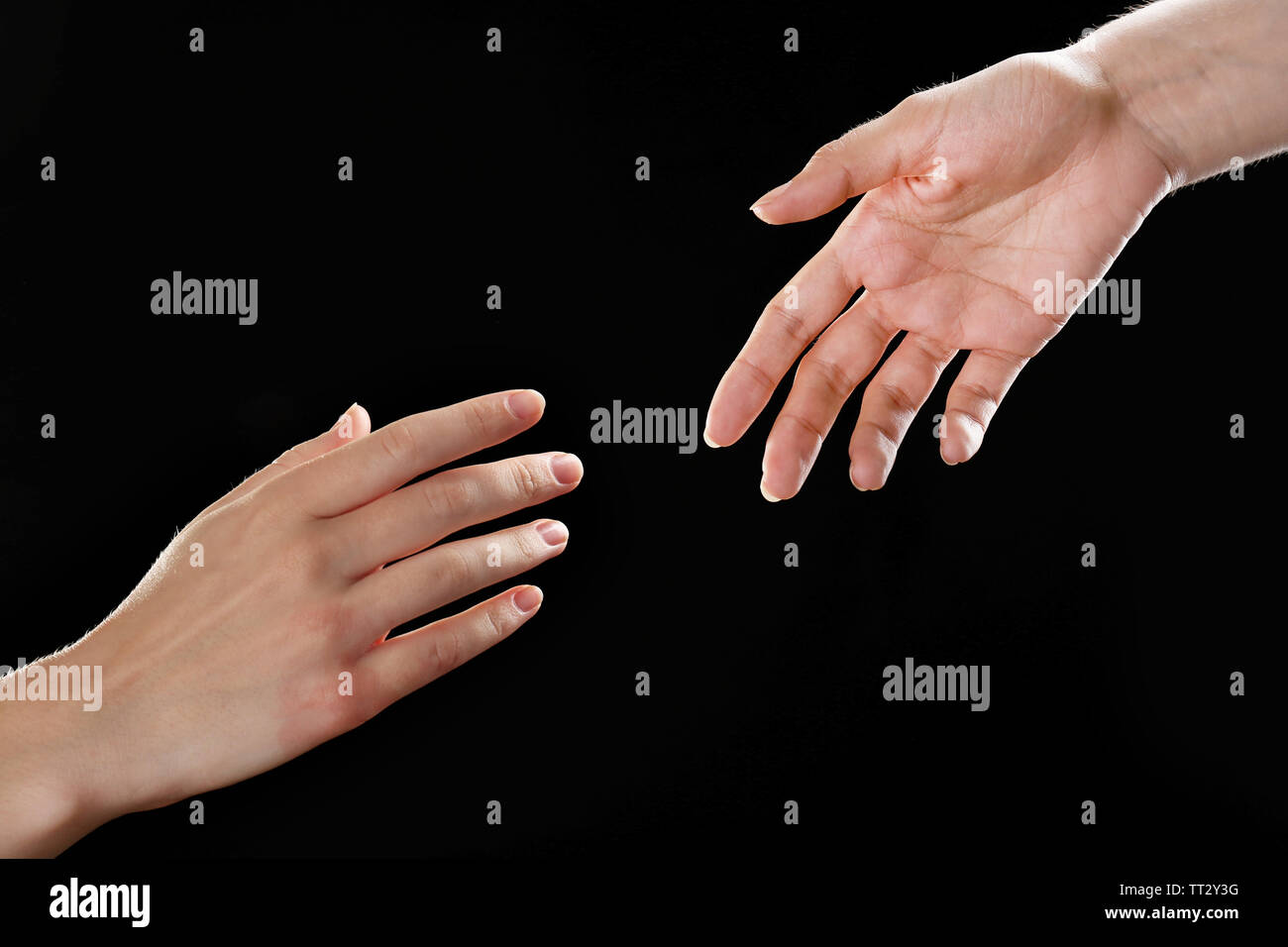 Human hands on black background Stock Photo - Alamy