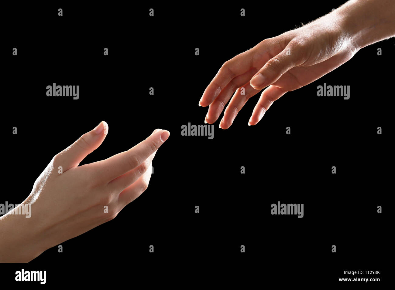Human hands on black background Stock Photo - Alamy
