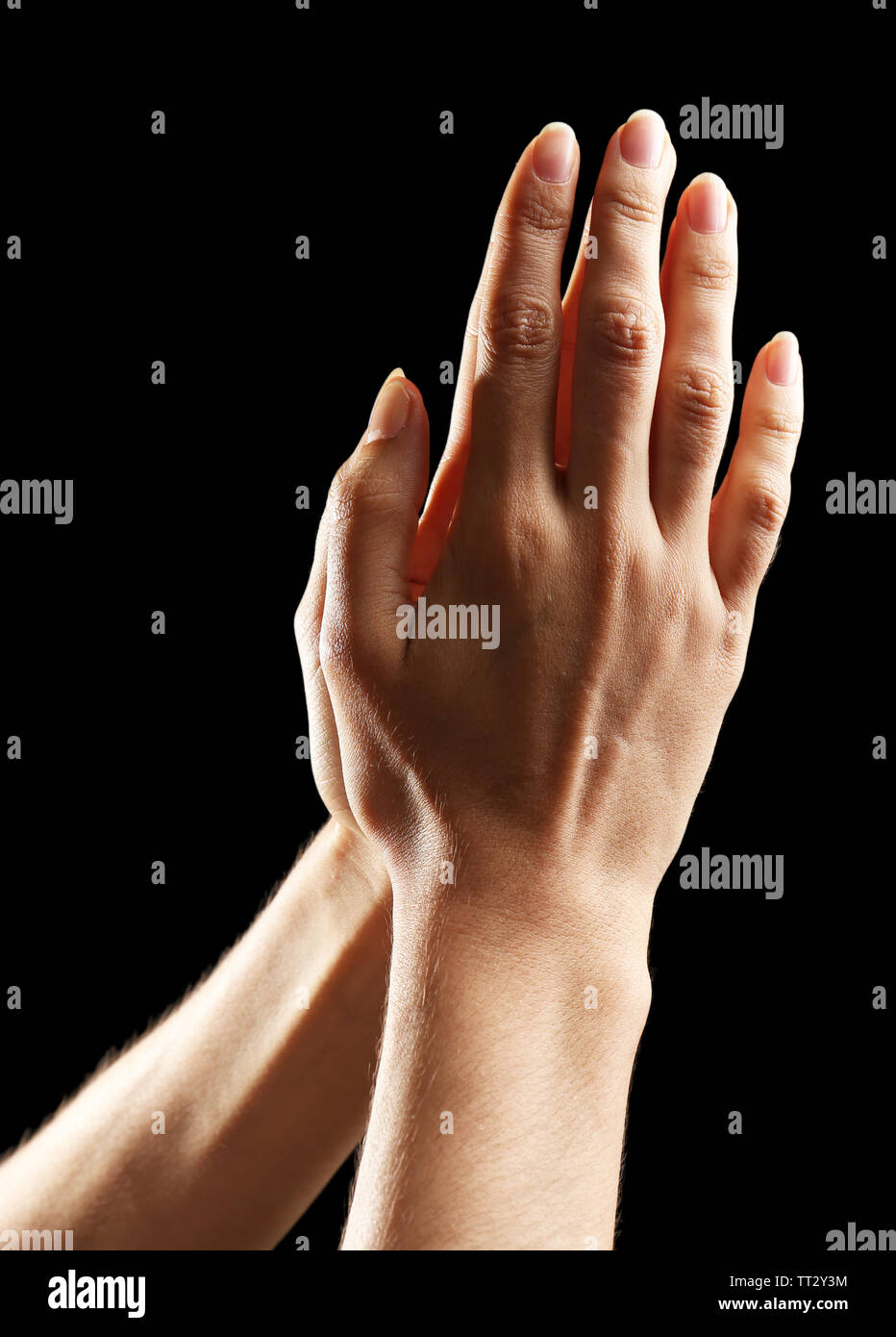 Human hands on black background Stock Photo - Alamy
