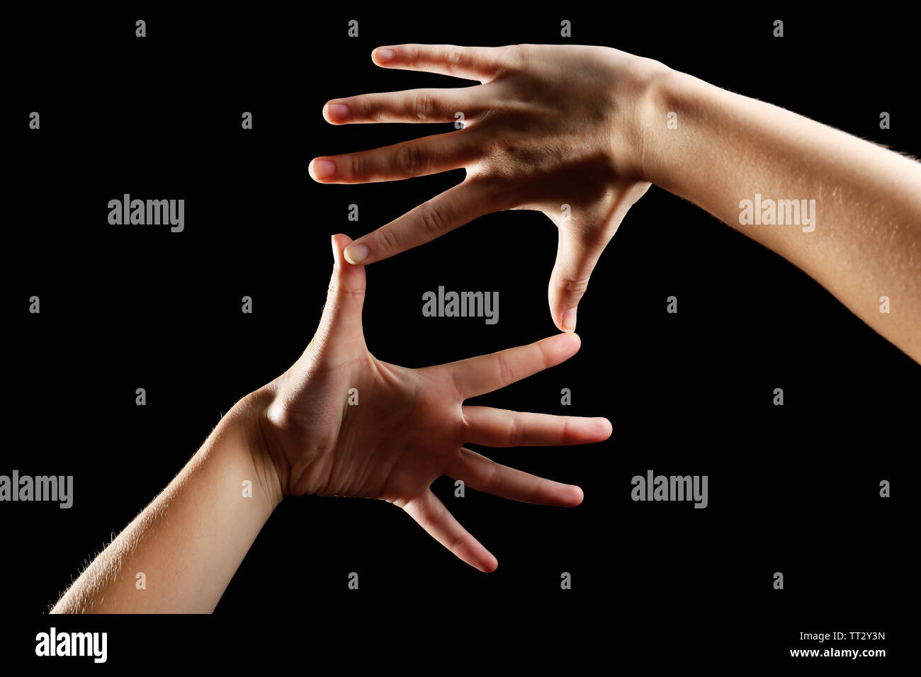 Human hands on black background Stock Photo - Alamy