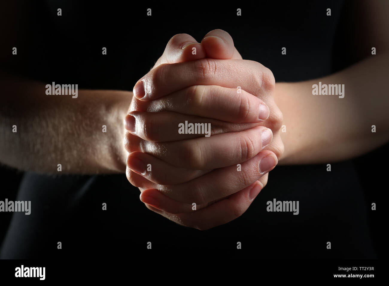Human hands on black background Stock Photo - Alamy