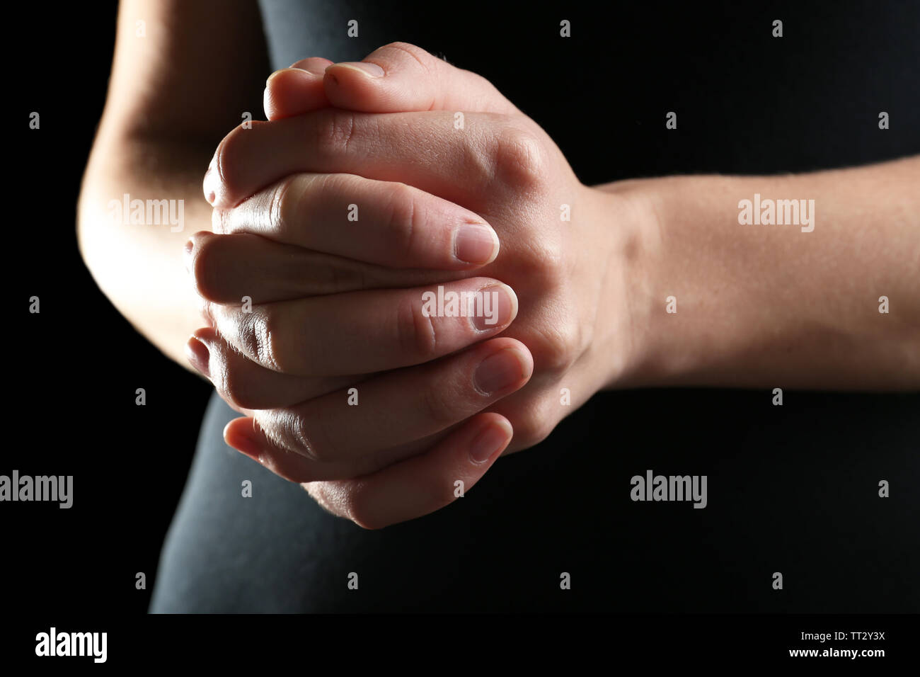 Human hands on black background Stock Photo - Alamy