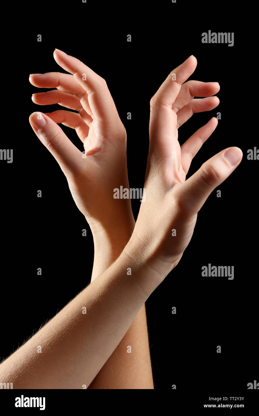 Human hands on black background Stock Photo - Alamy