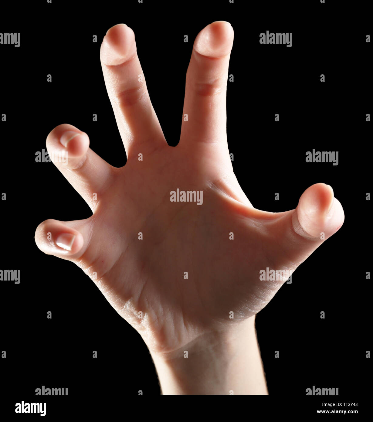 Human hand on black background Stock Photo - Alamy