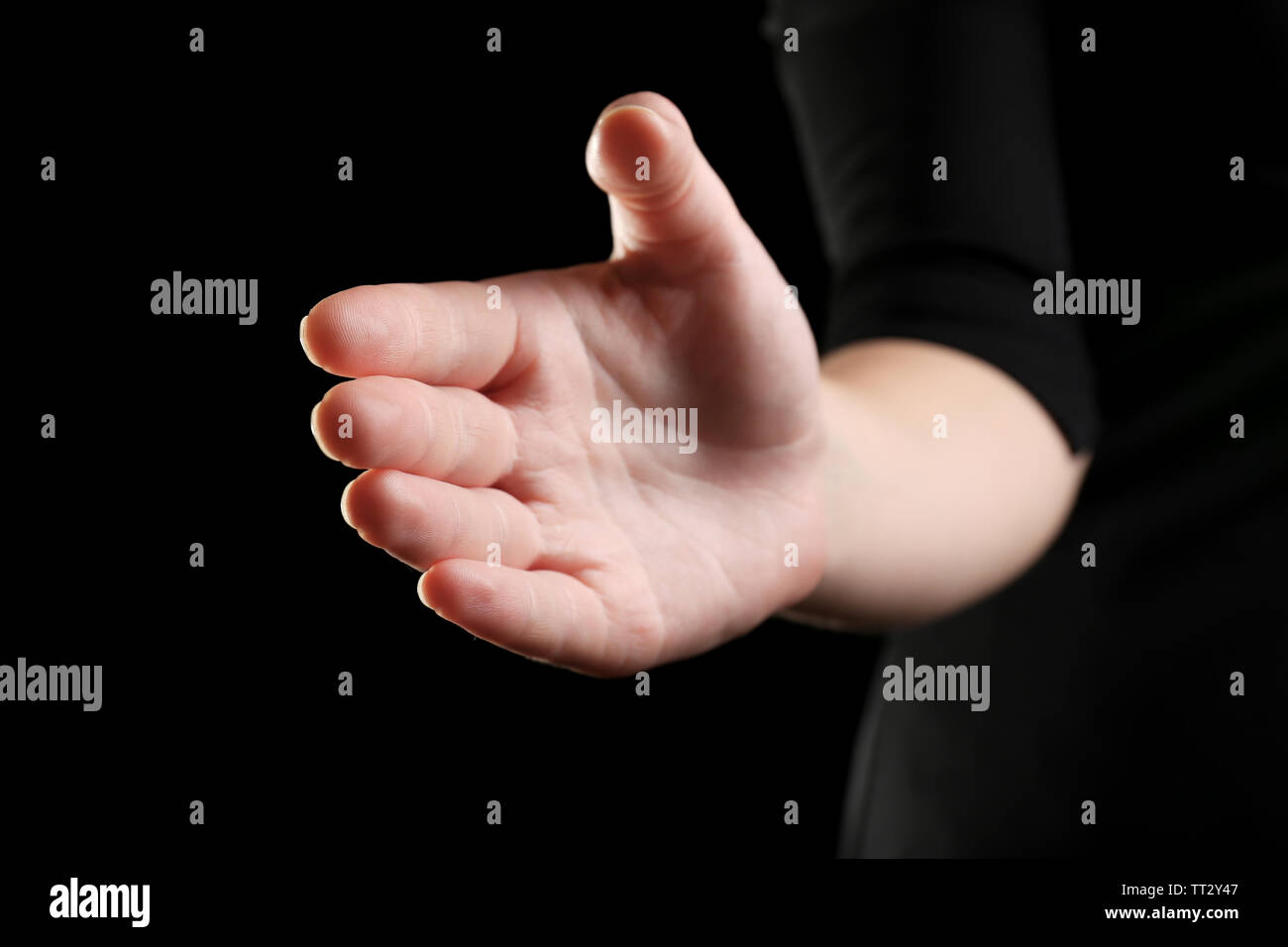 Human hand on black background Stock Photo - Alamy