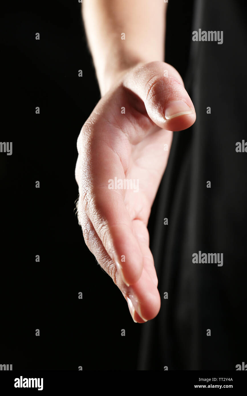 Human hand on black background Stock Photo - Alamy