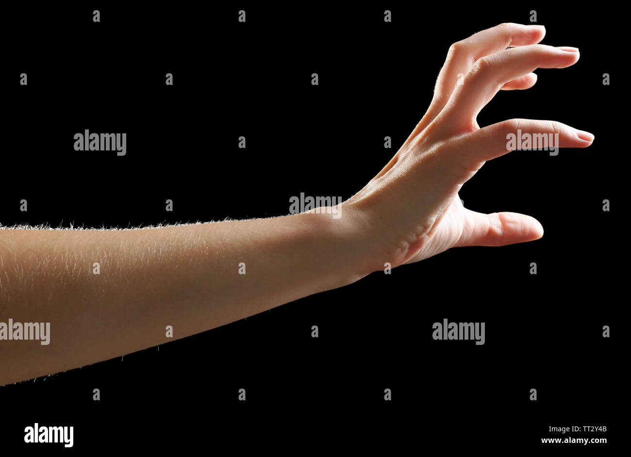 Human hand on black background Stock Photo - Alamy