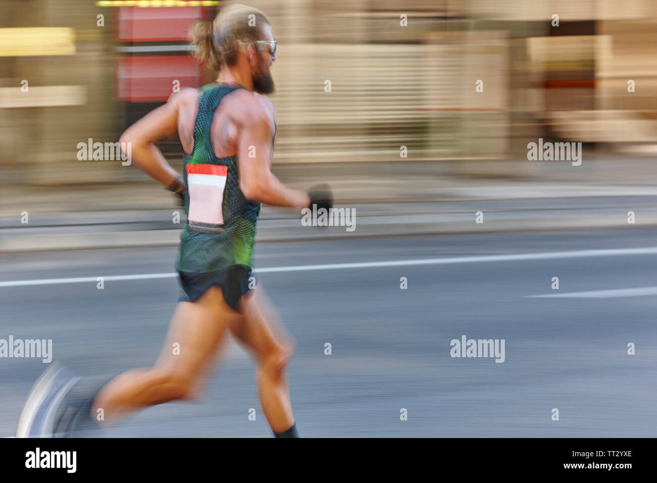 Marathon runner in motion on the street. Healthy lifestyle. Exercise ...