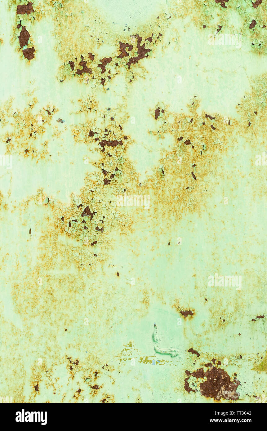 Background of rusty metal painted in green paint.The texture of the ...