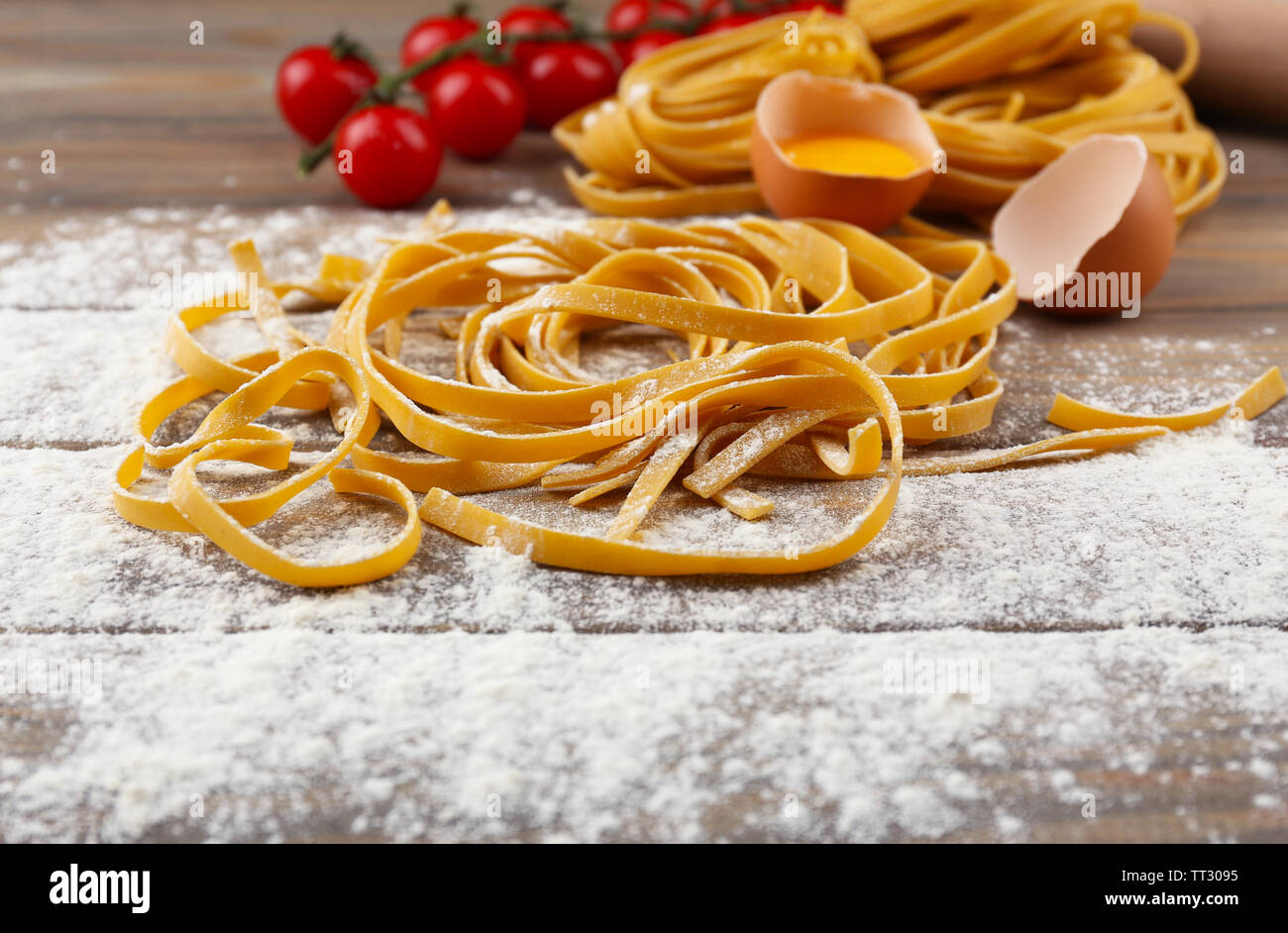 Still life with raw homemade pasta and ingredients for pasta Stock ...