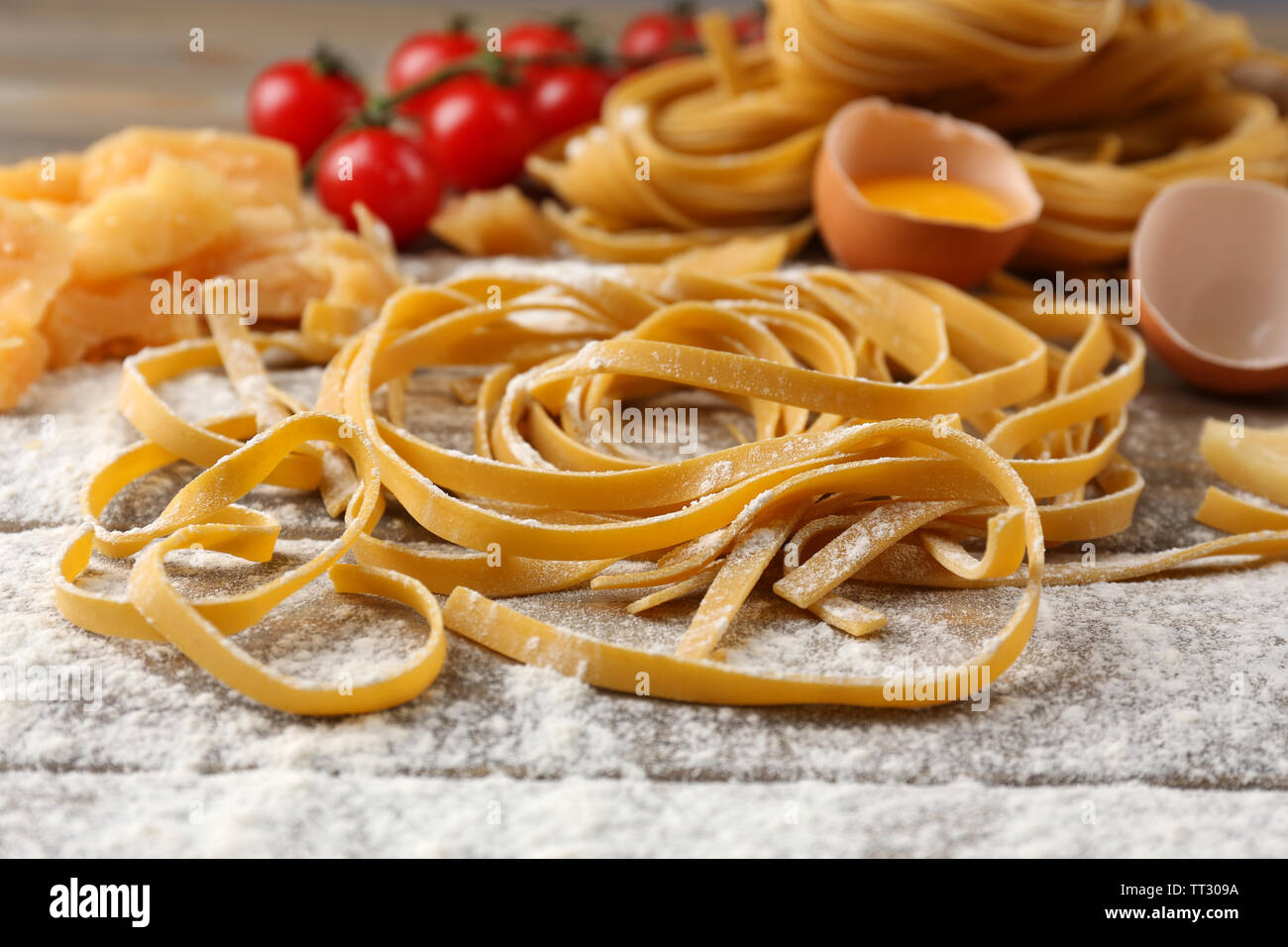 Still life with raw homemade pasta and ingredients for pasta Stock ...