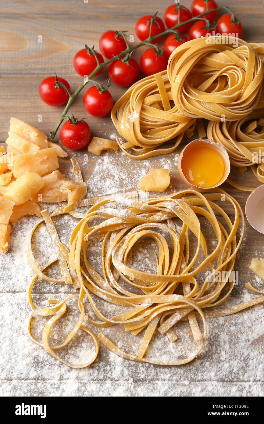 Still life with raw homemade pasta and ingredients for pasta Stock ...