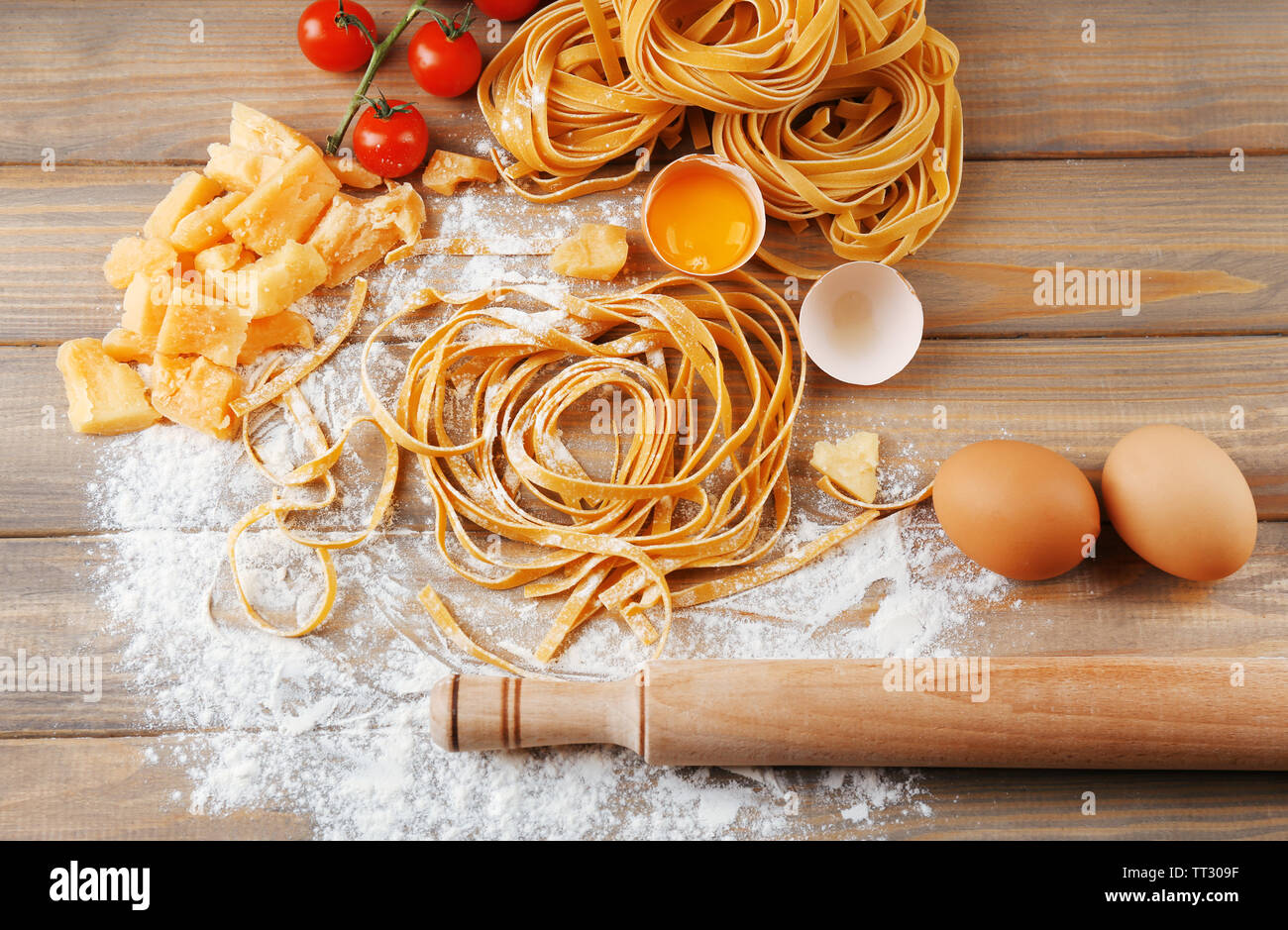 Still life with raw homemade pasta and ingredients for pasta Stock ...