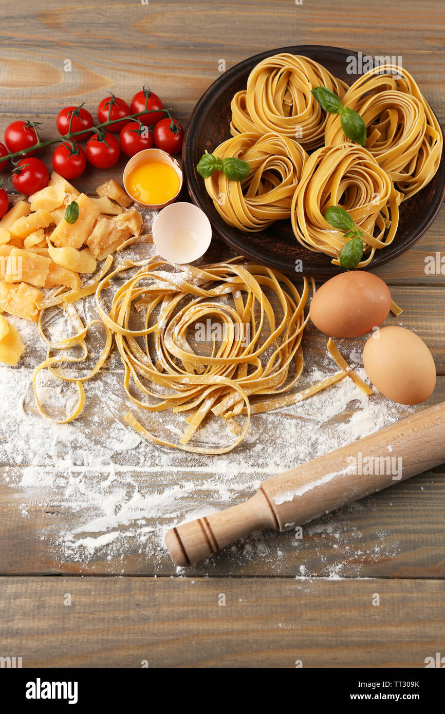 Still life with raw homemade pasta and ingredients for pasta Stock ...