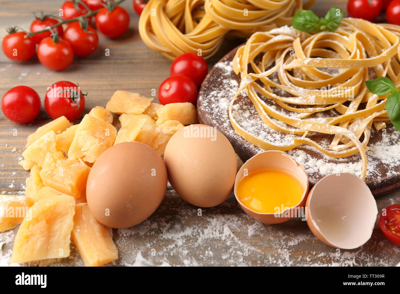 Still life with raw homemade pasta and ingredients for pasta Stock ...