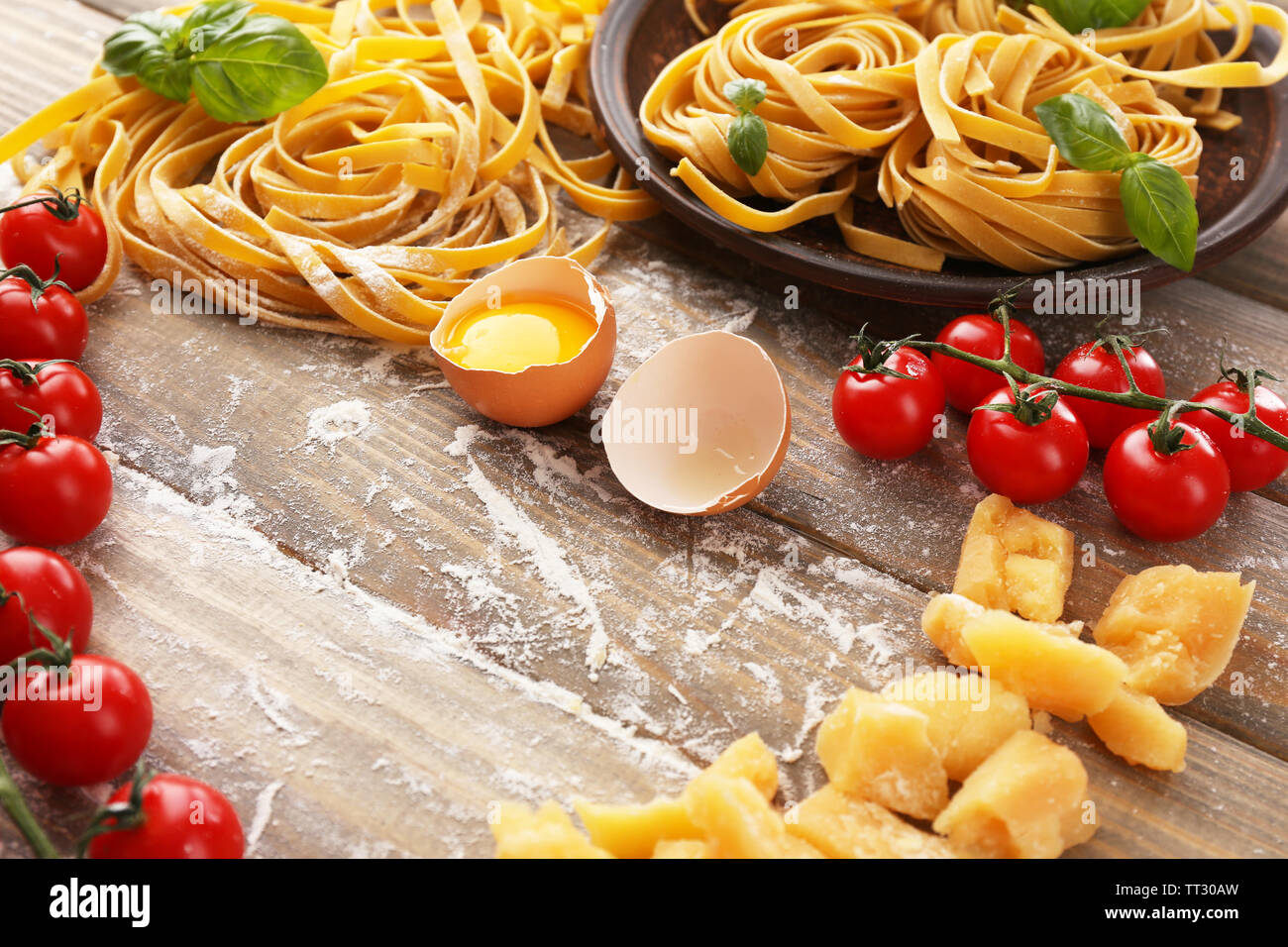 Still life with raw homemade pasta and ingredients for pasta Stock ...