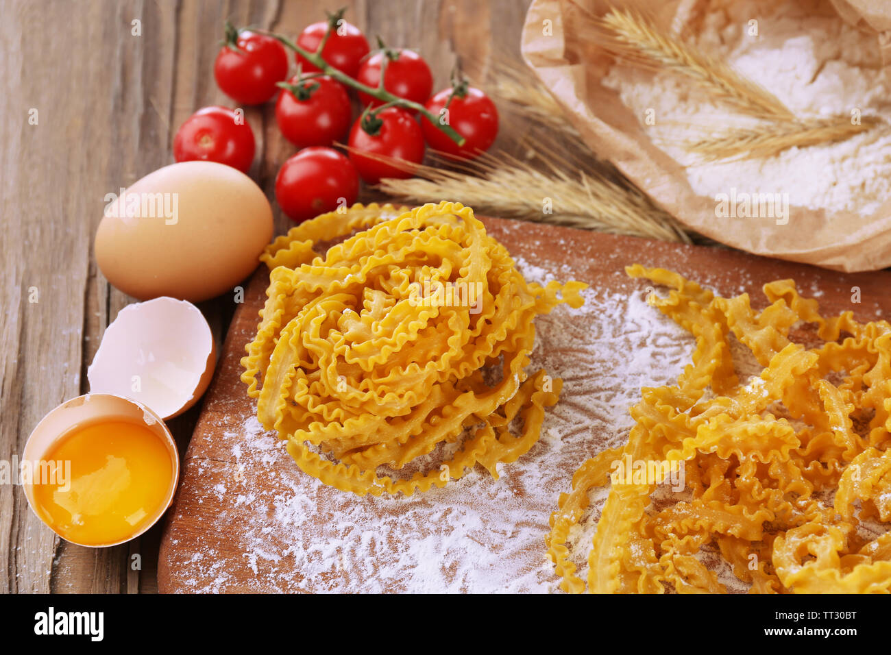 Still life with raw homemade pasta and ingredients for pasta Stock ...