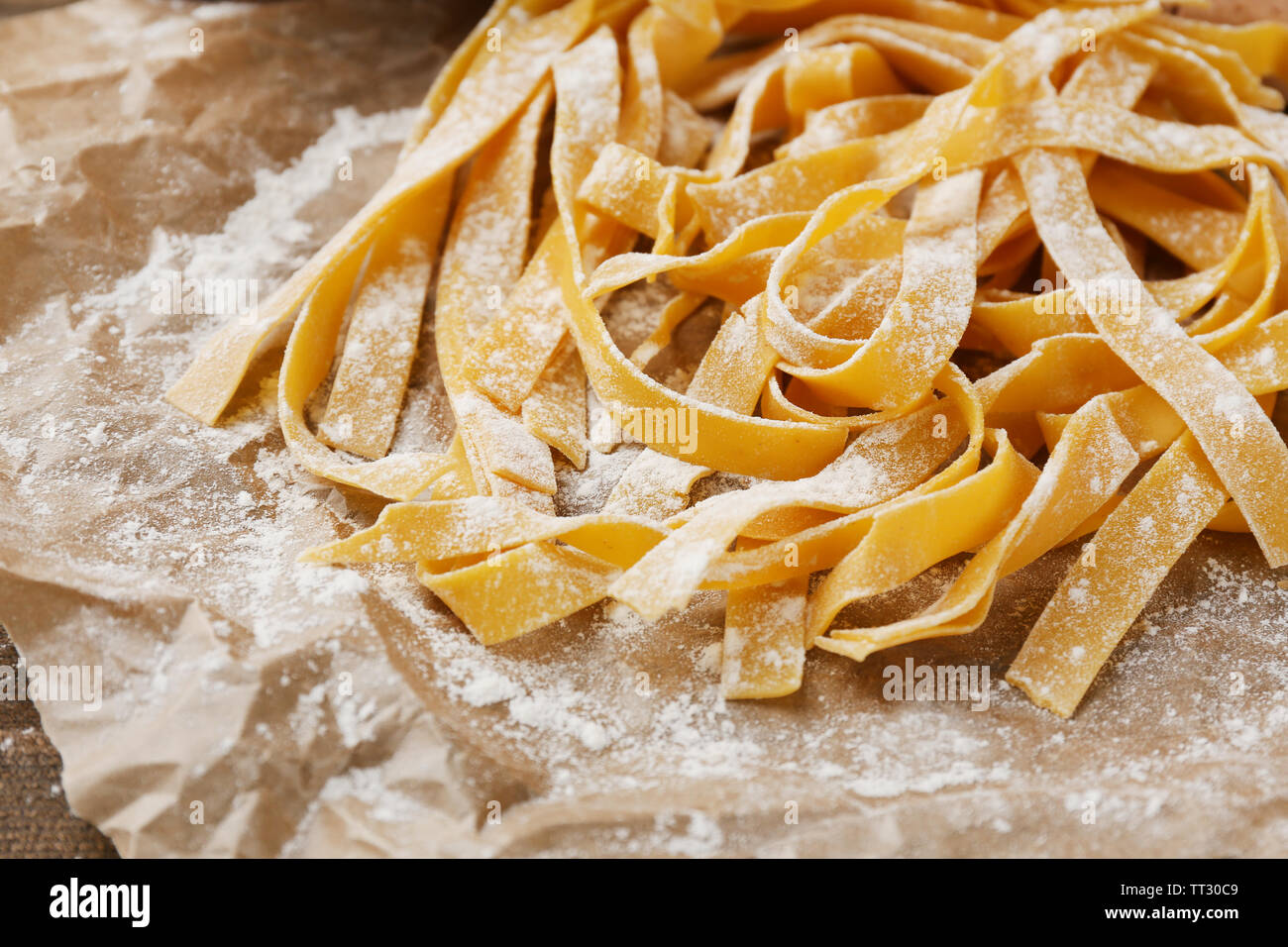 Still life with raw homemade pasta and ingredients for pasta Stock ...