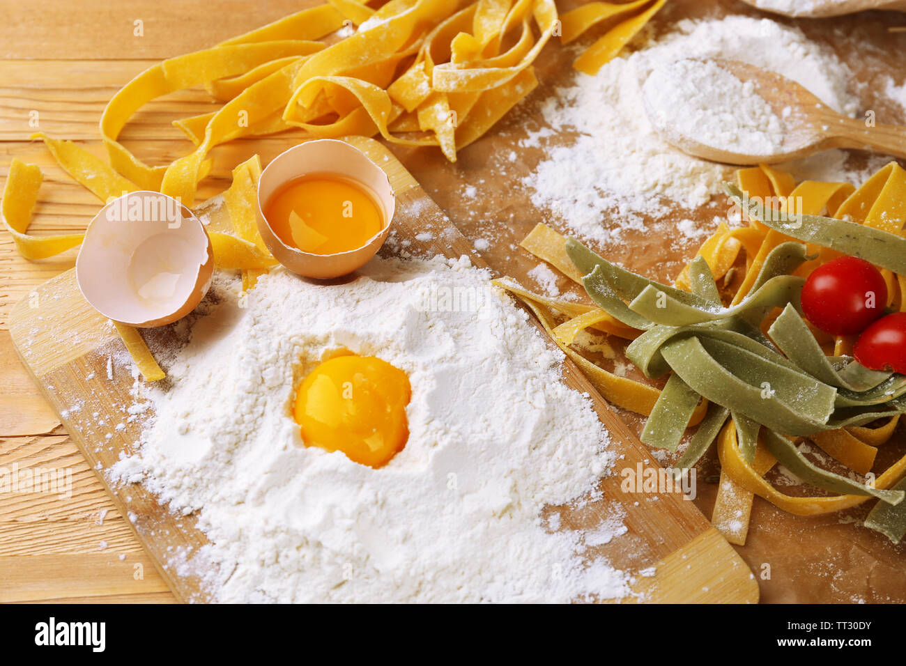 Still life with raw homemade pasta and ingredients for pasta Stock ...