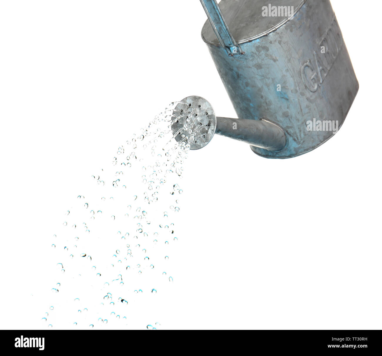 Water pouring from watering can isolated on white Stock Photo - Alamy