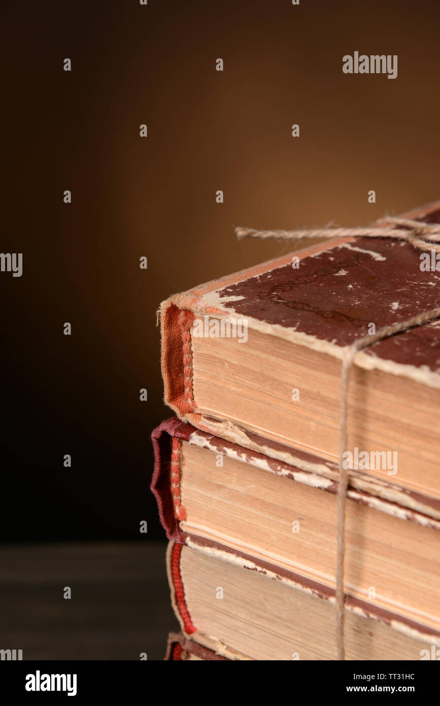Old books on table on brown background Stock Photo - Alamy