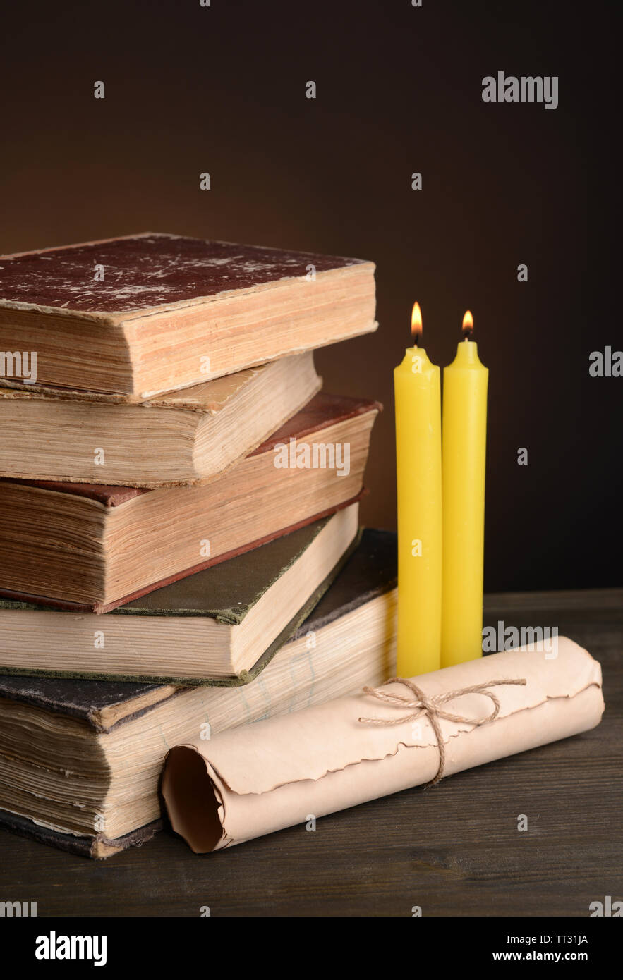Old books on table on brown background Stock Photo - Alamy