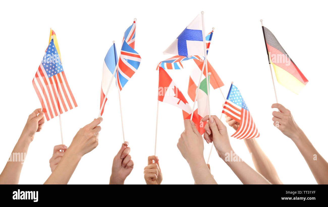 Hands holding different flags, isolated on white Stock Photo - Alamy