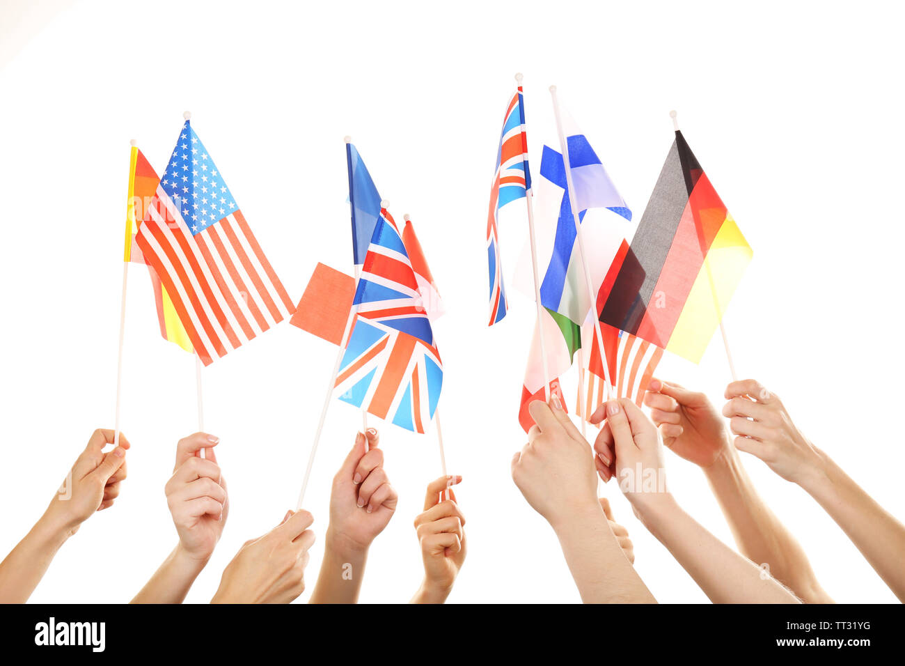 Hands holding different flags, isolated on white Stock Photo - Alamy