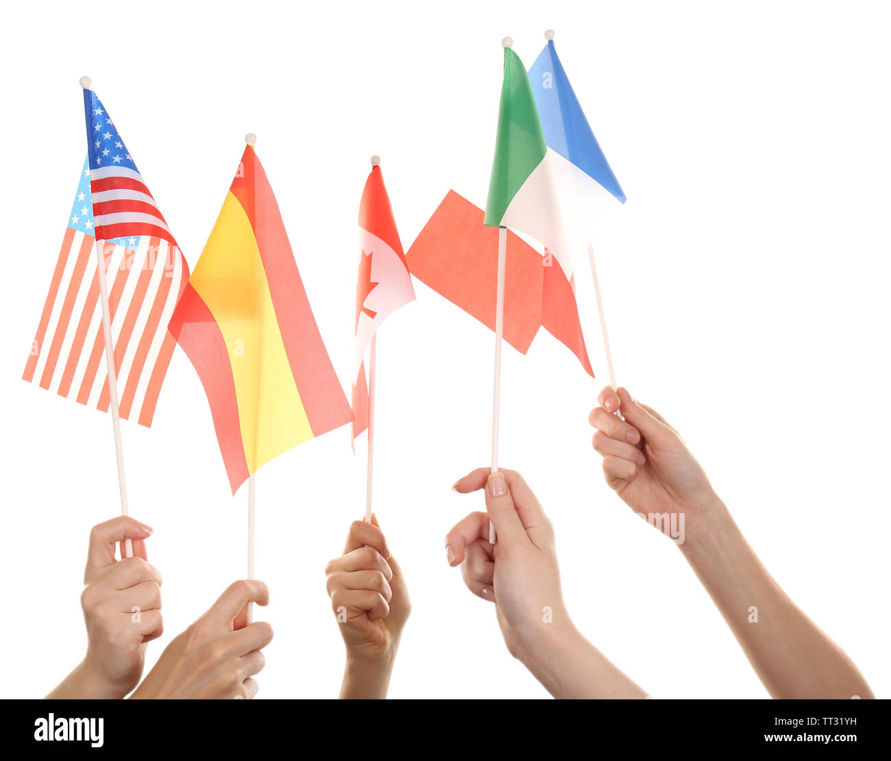 Hands holding different flags, isolated on white Stock Photo - Alamy