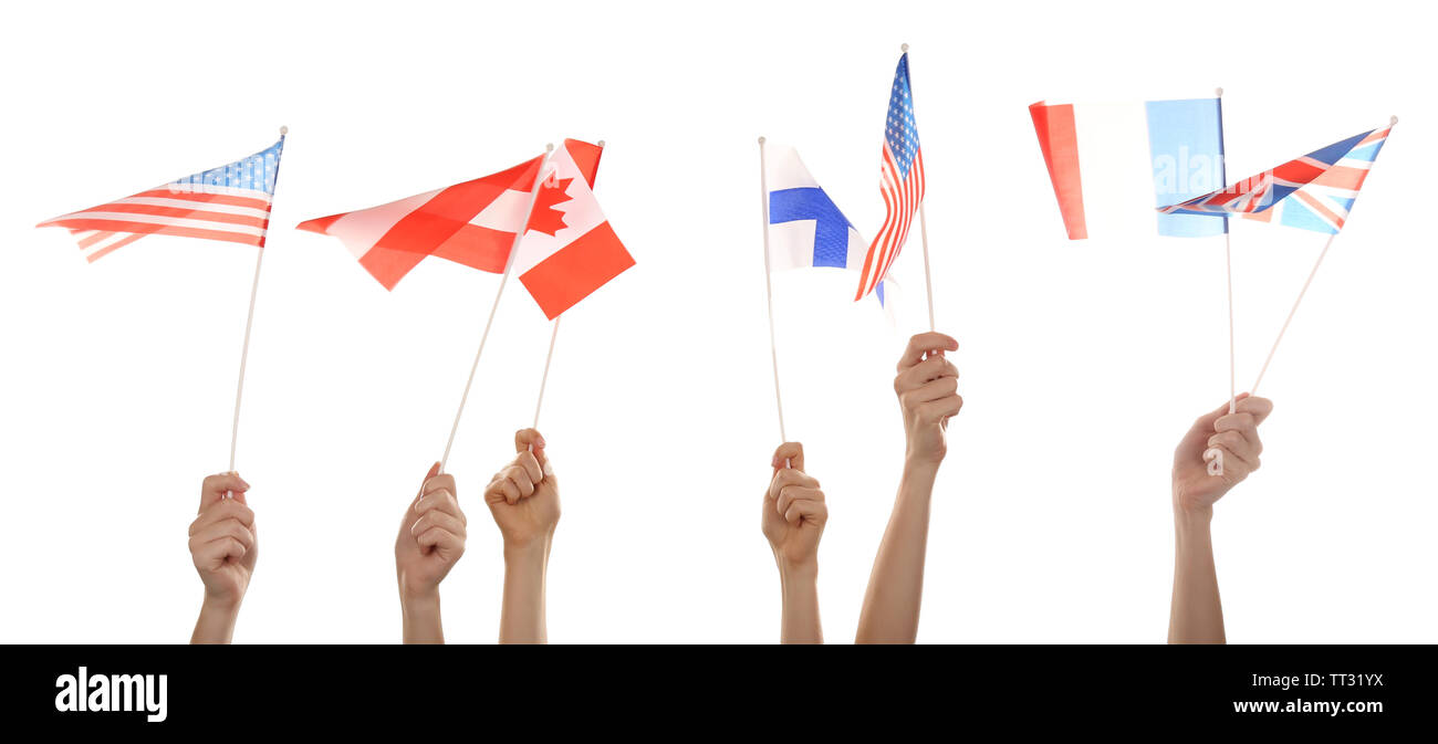 Hands holding different flags, isolated on white Stock Photo - Alamy