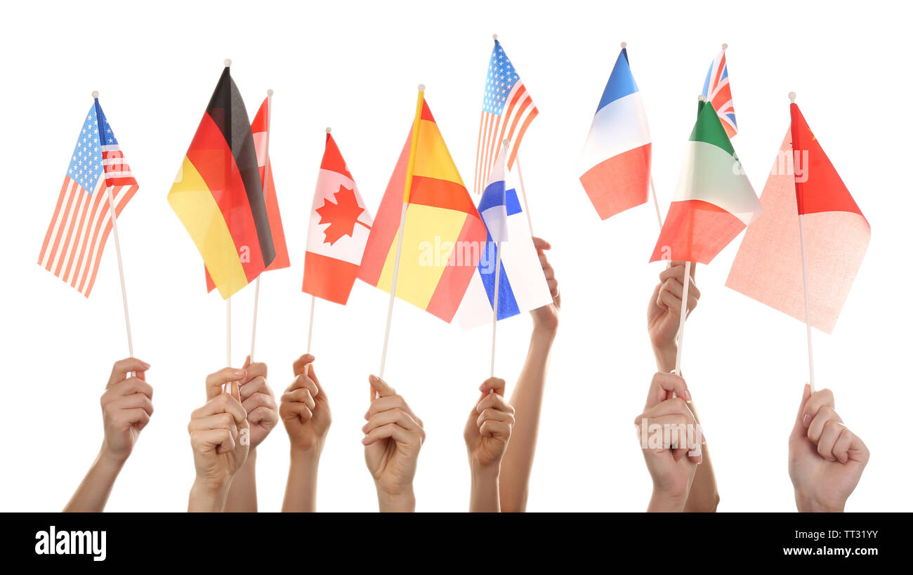 Hands holding different flags, isolated on white Stock Photo - Alamy